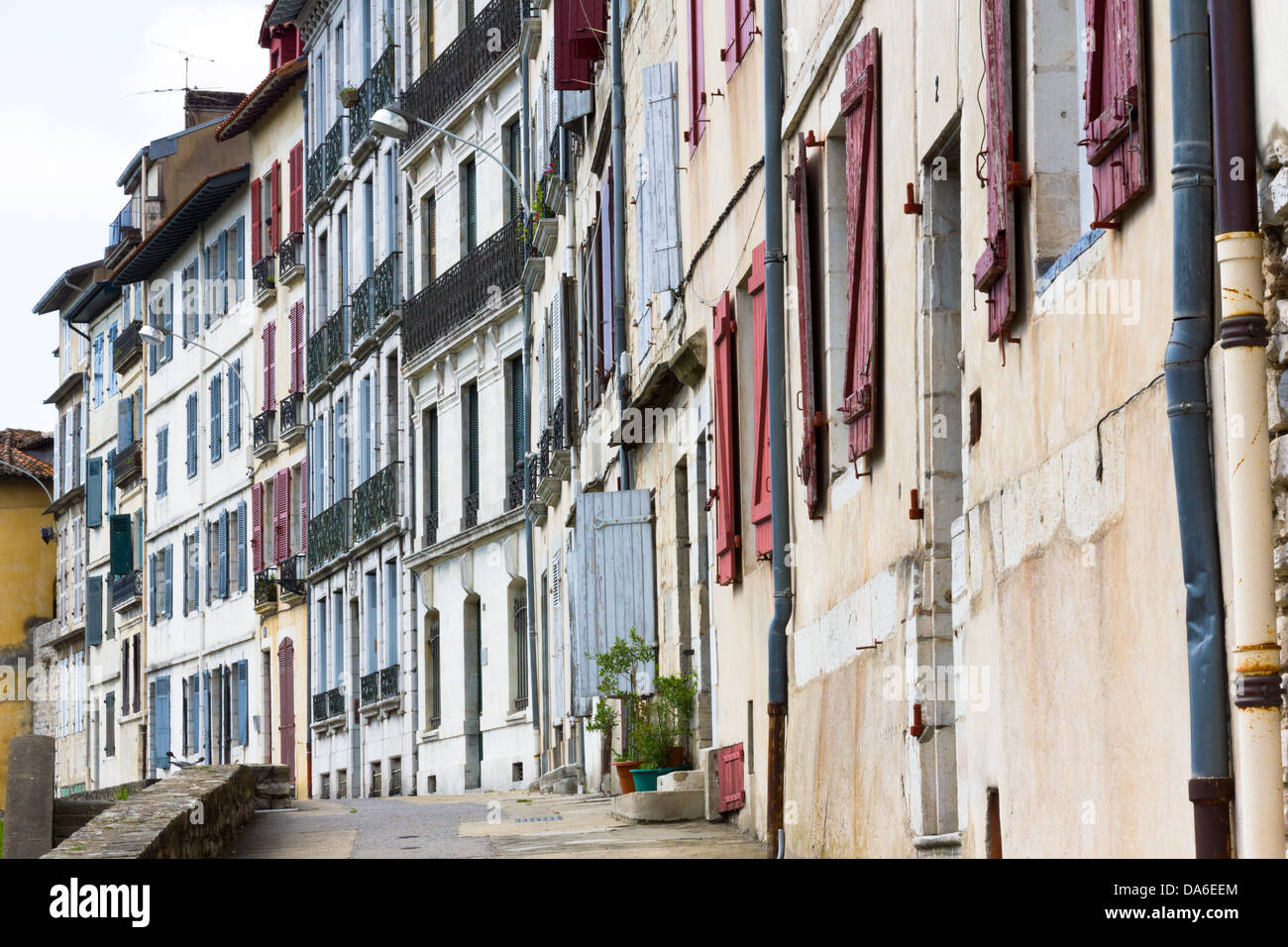 Ancient Bayonne terrace with colourful window shutters Stock Photo - Alamy