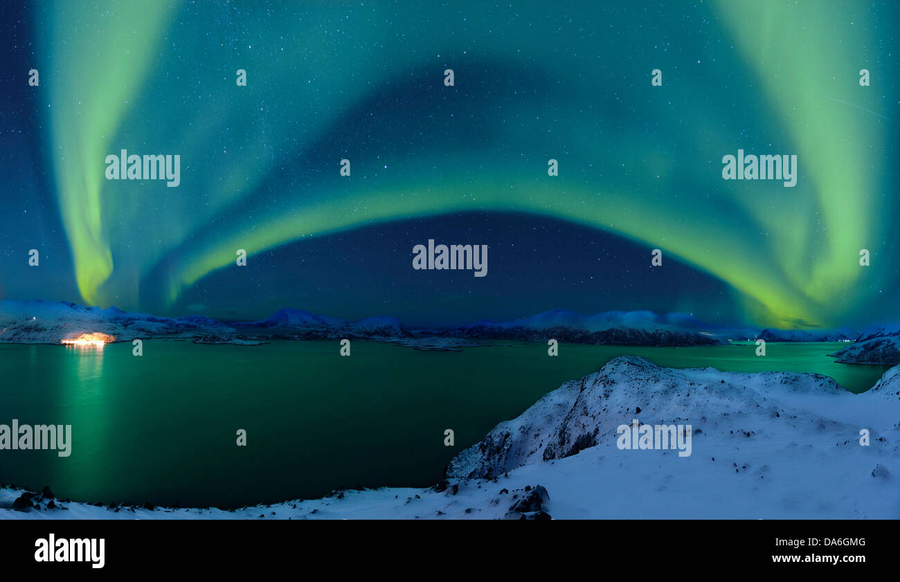 Aurora over a fjord with snow-covered mountains Stock Photo - Alamy