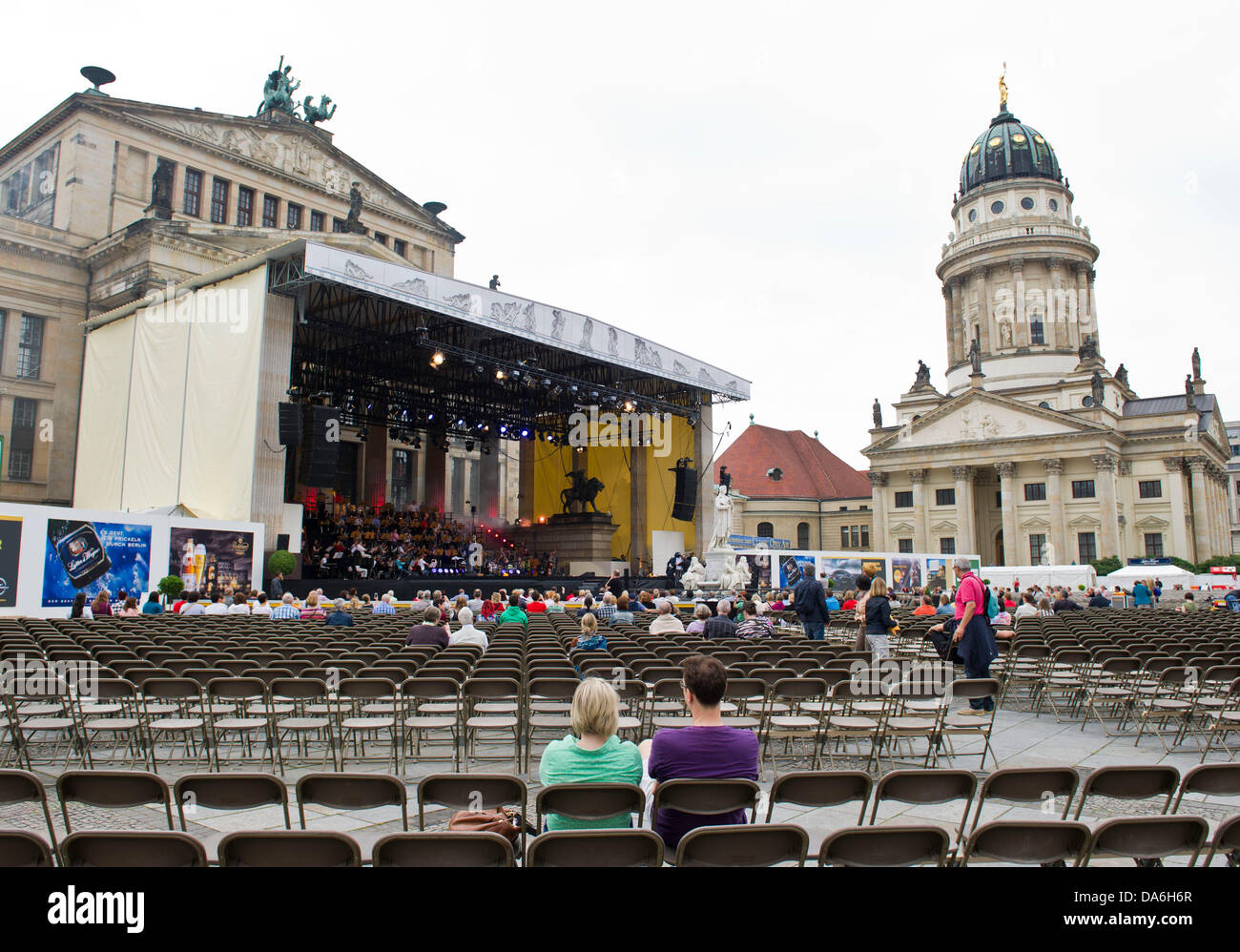 People sit at the stage during the Classic Open Air at Gendarmenmarkt ...