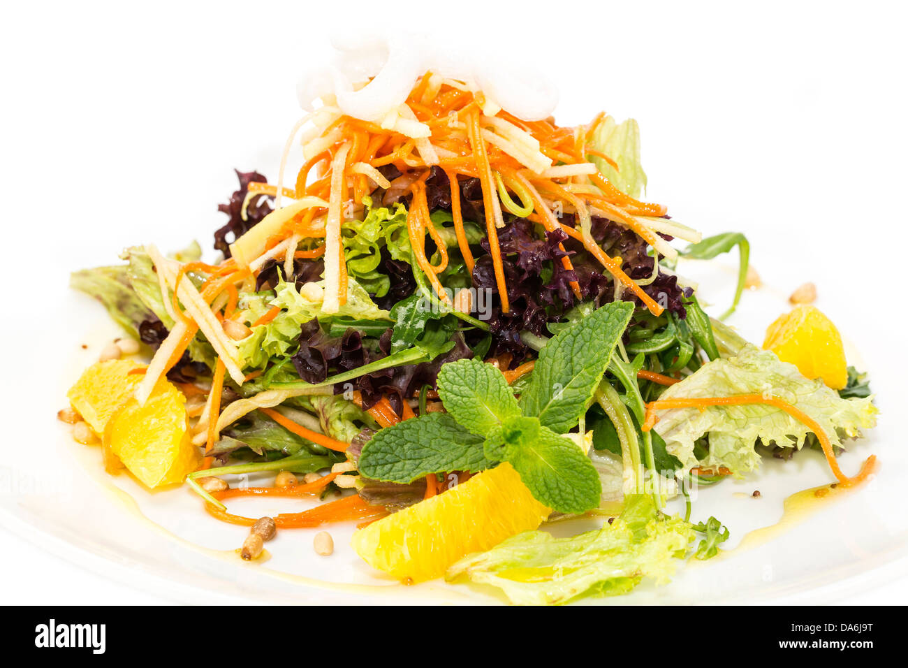 salad of fruit and vegetables on a white background in the restaurant ...