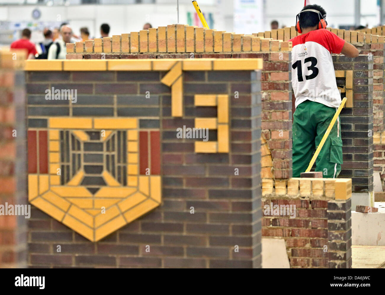 A bricklayer participating in the competition 'WorldSkills Leipzig 2013 ...