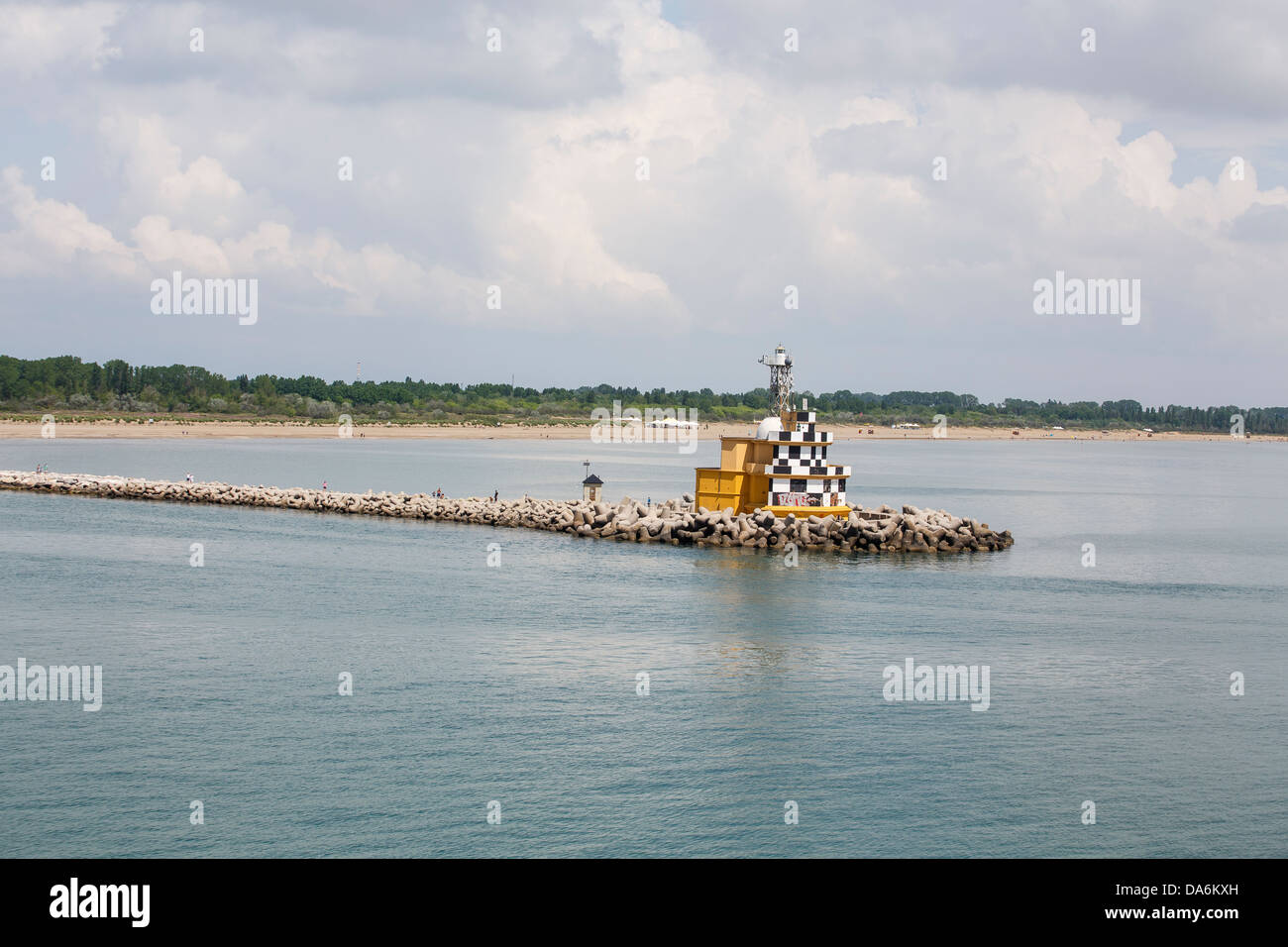 Black and white beacon at the entrance to the shipping channel into ...