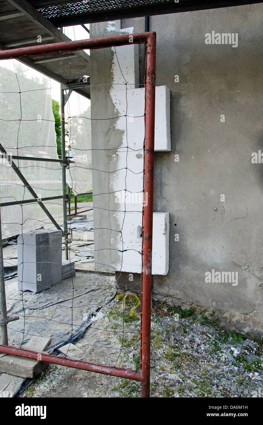 Photo of building being insolated with styrofoam Stock Photo - Alamy