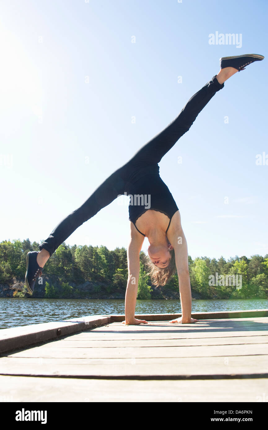 Woman doing cartwheel hi-res stock photography and images - Alamy