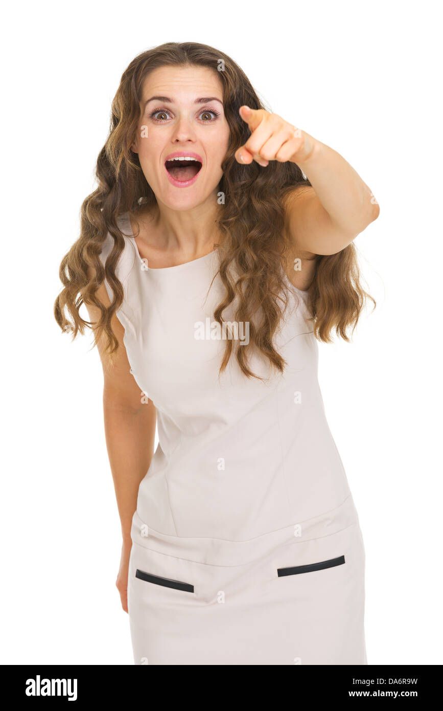 Surprised young woman pointing in camera Stock Photo - Alamy