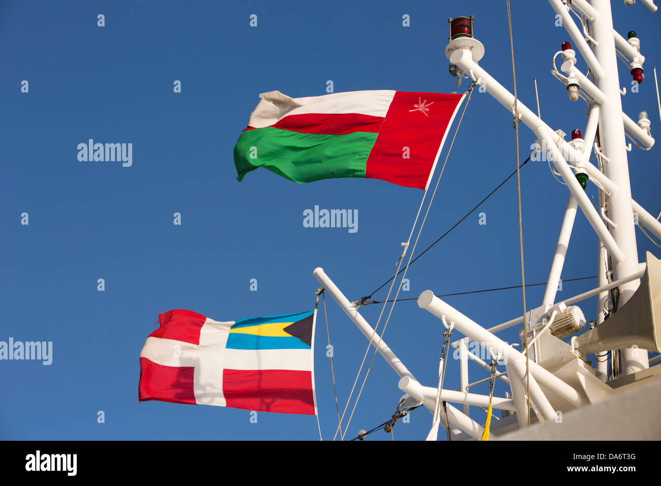 Oman, Salalah, MV Minerva, Omani and Bahamian flags flying Stock Photo ...