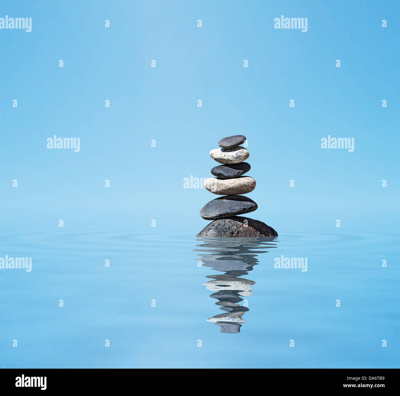 Zen meditation background - balanced stones stack in water with ...