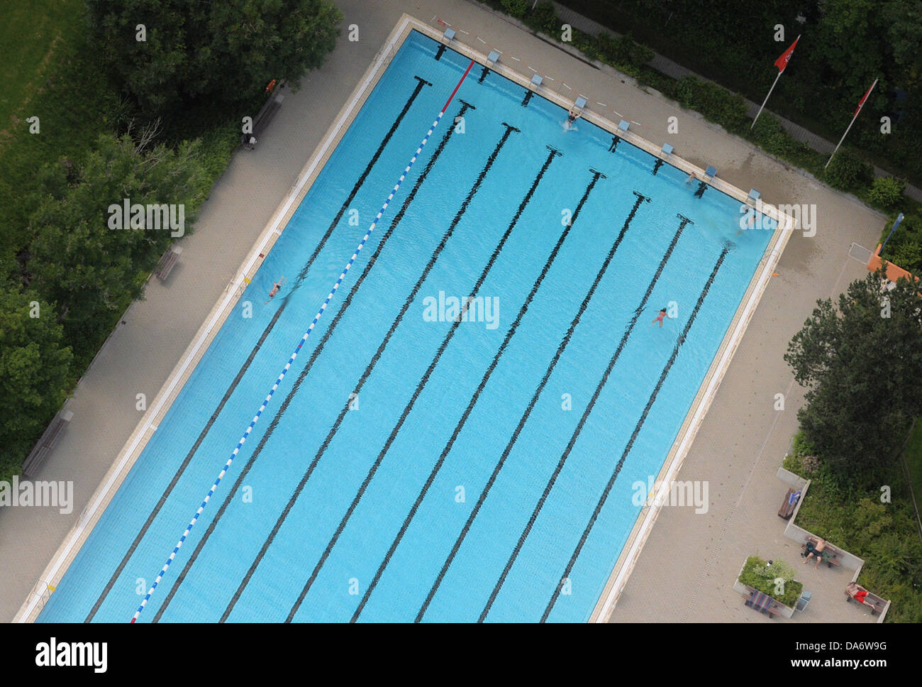Five guests swim in the public swimming pool in Freiburg, Germany, 05 ...