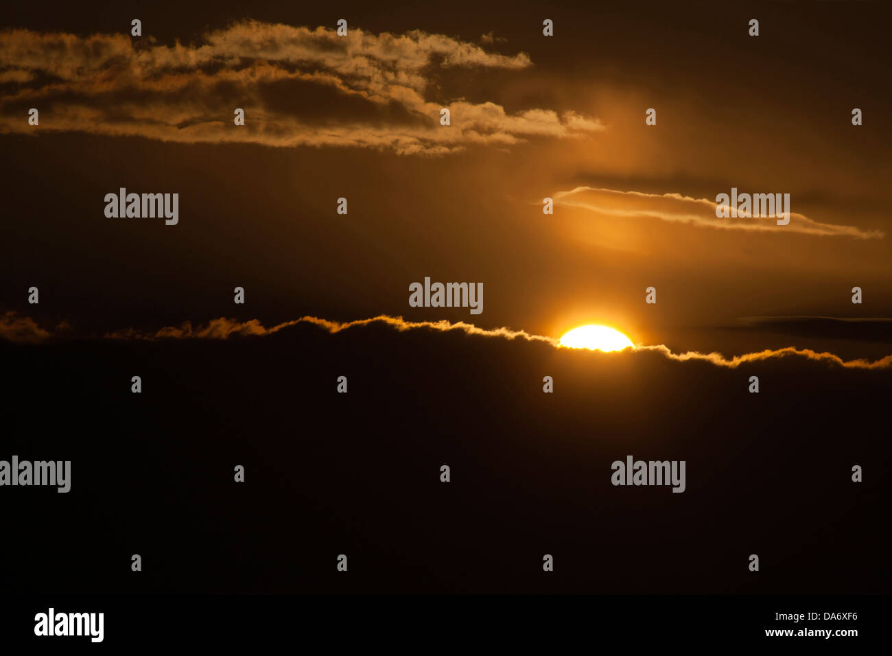 Sunset with sun clouds over clouds hi-res stock photography and images ...