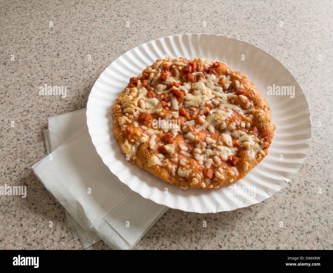 Cooked Frozen Pizza on Paper Plate Stock Photo - Alamy