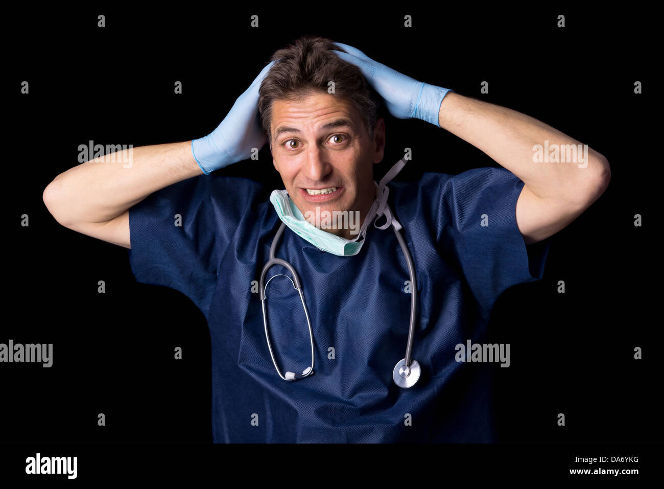 Stressed doctor in uniform isolated against a black background Stock ...