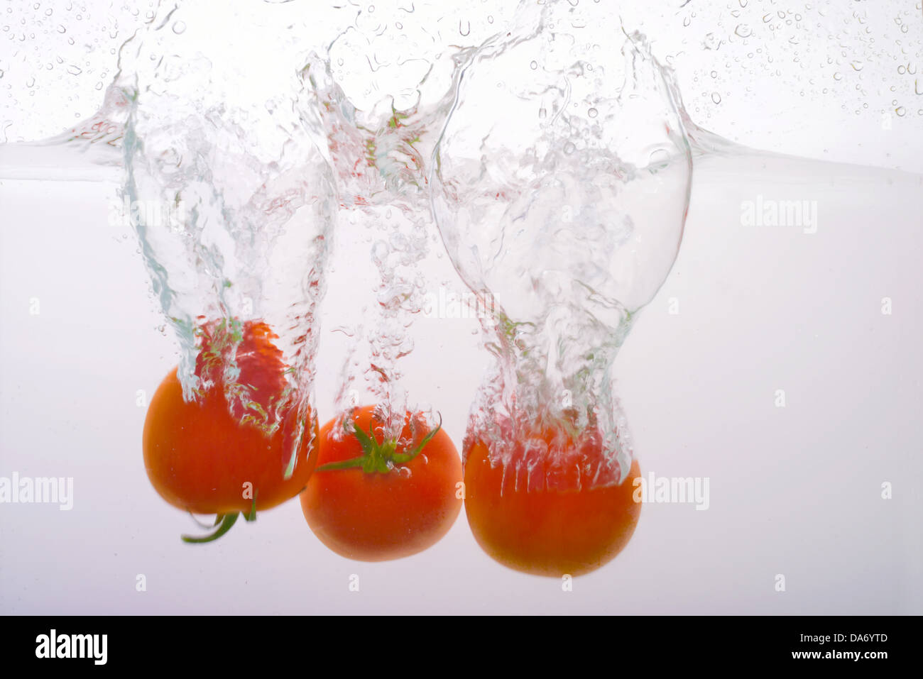 Tomatoes splashing in water hi-res stock photography and images - Alamy