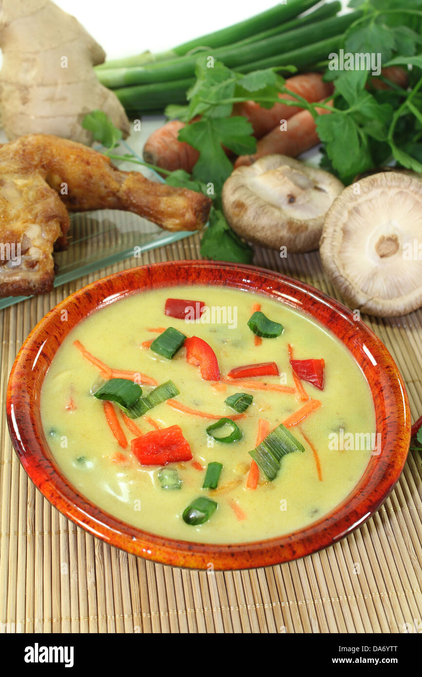 Curry soup with colorful vegetables and chicken Stock Photo - Alamy