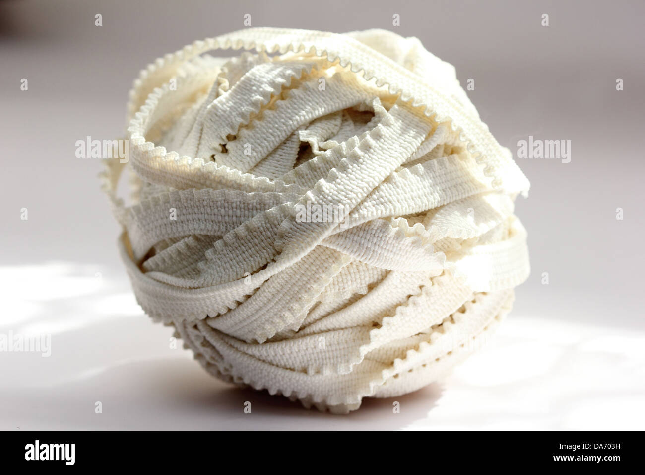 a tangle of white elastic band for clothes Stock Photo - Alamy