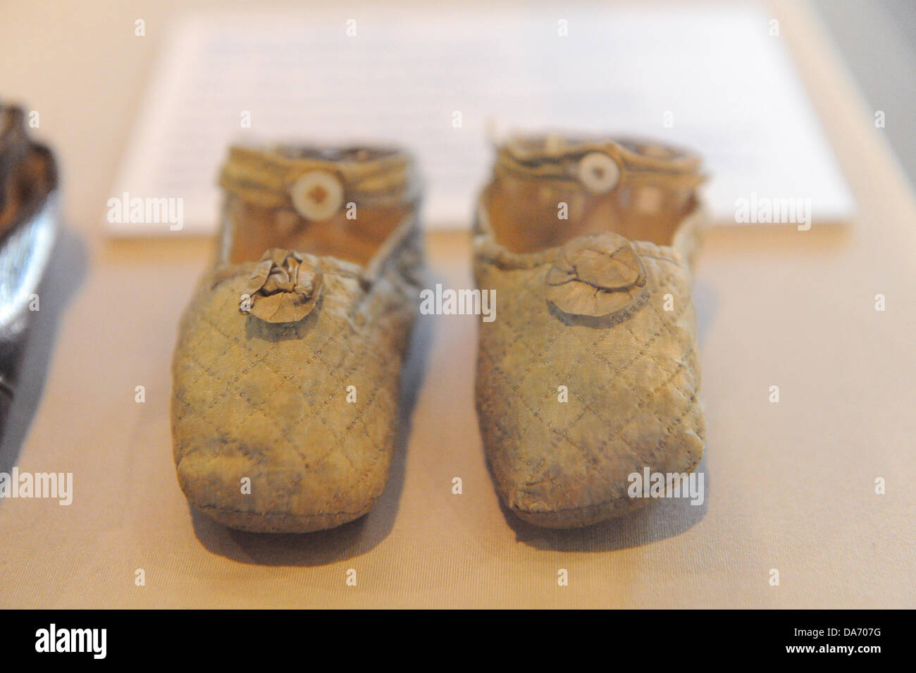 Museum of London, London, UK. 5th July 2013. A selection of shoes worn ...