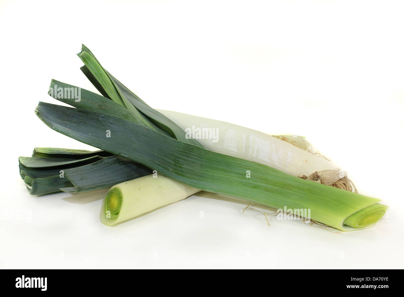 raw leek rods in front of white background Stock Photo - Alamy