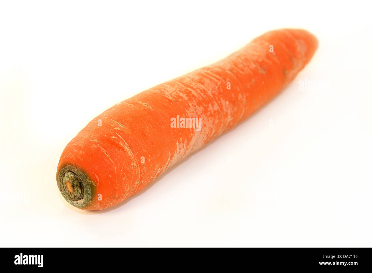 a raw carrot in front of a white background Stock Photo - Alamy
