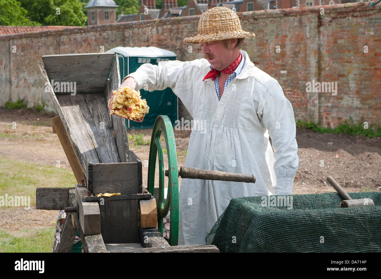 Man making cider the old fashioned way, Blickling Hall fair, Norfolk ...