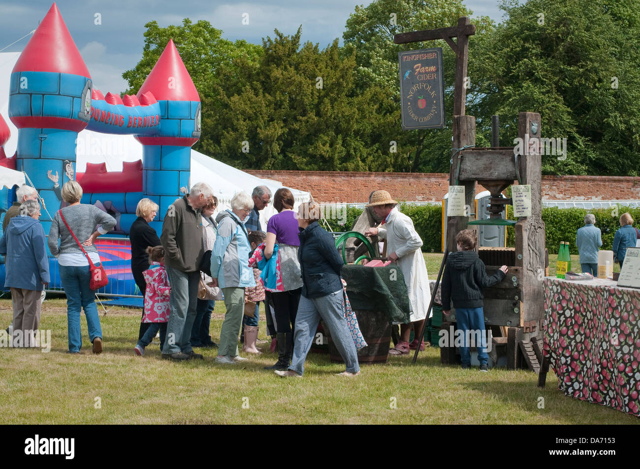 Man making cider the old fashioned way, Blickling Hall fair, Norfolk ...