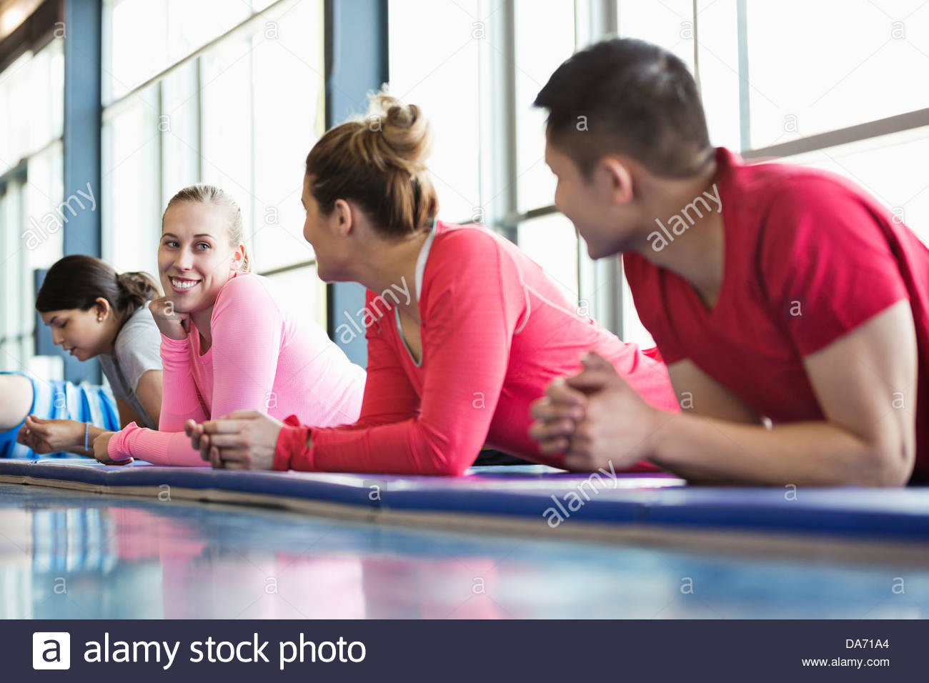 Group smiling people exercising in hi-res stock photography and images ...