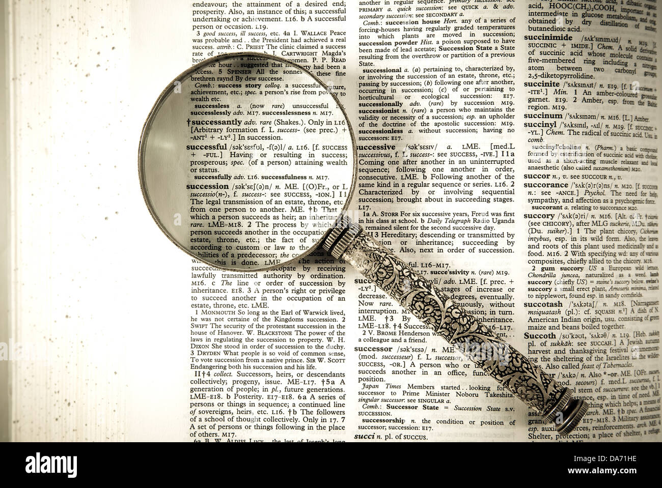 A magnifying glass on the word successful on a dictionary Stock Photo ...