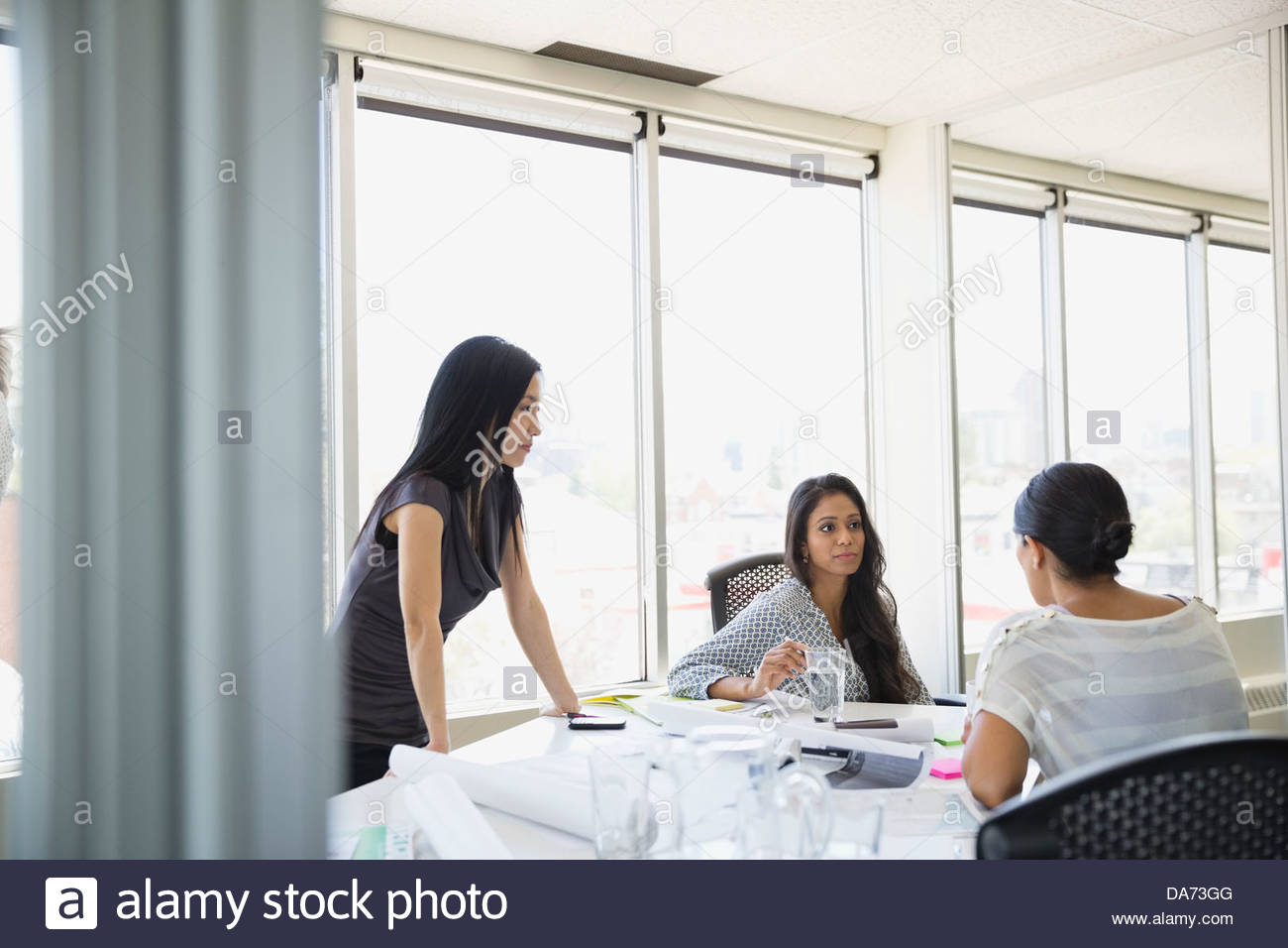 Businesswomen working on project in office Stock Photo - Alamy