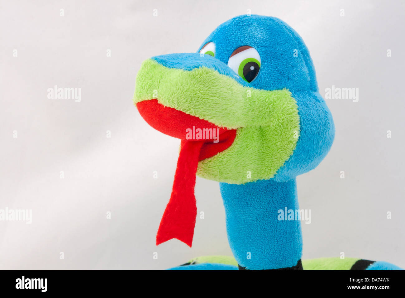 soft toy snake closeup against white background Stock Photo - Alamy