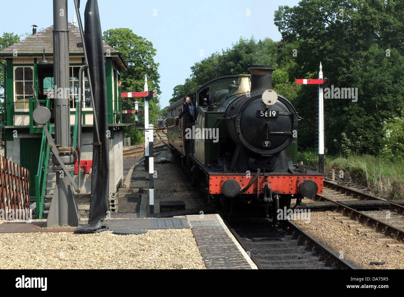 A steam train arrives at Holt station on the North Norfolk railway ...
