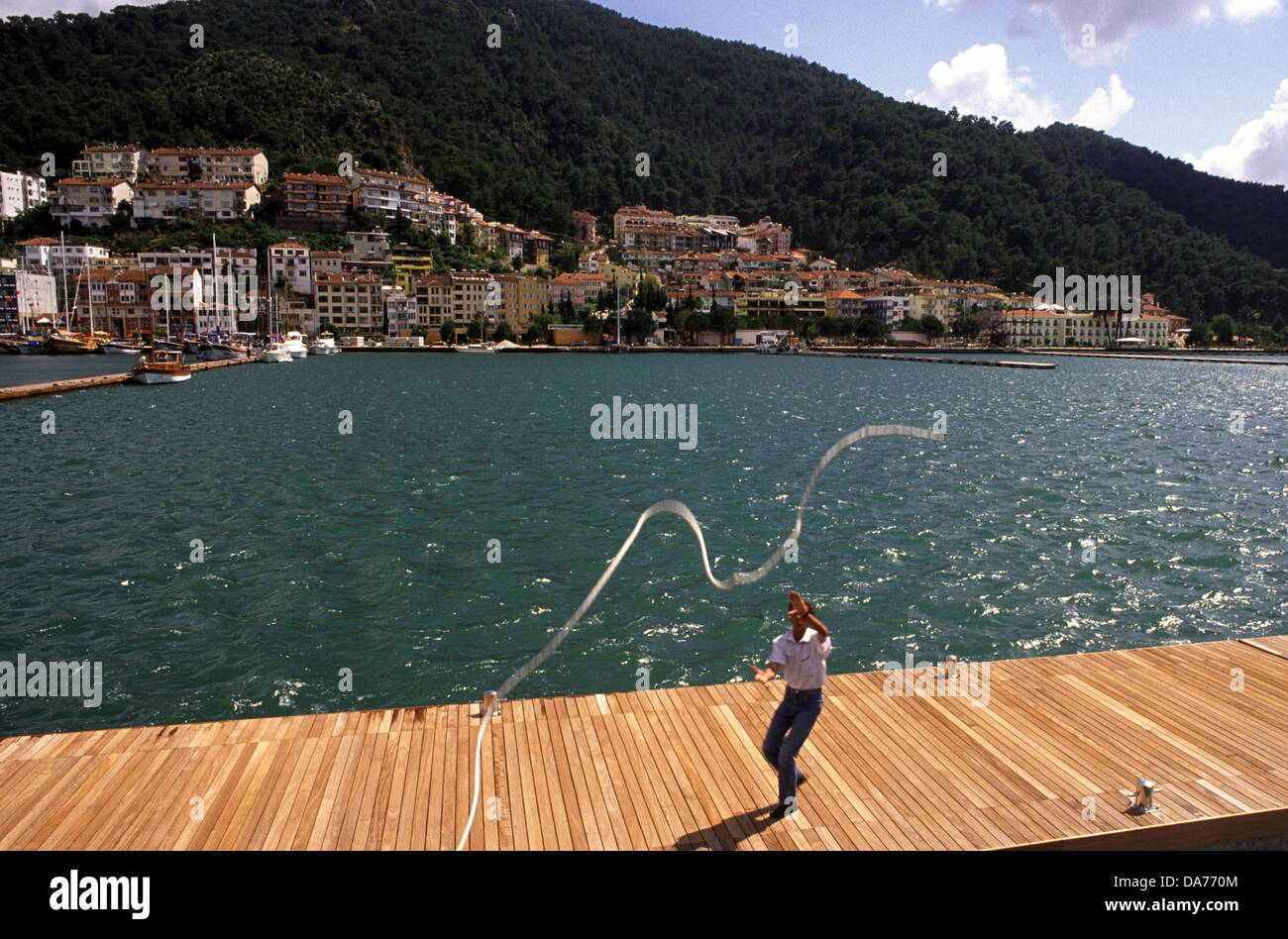 Dockworker in Fethiye bay along the shoreline of the Turkish Riviera ...