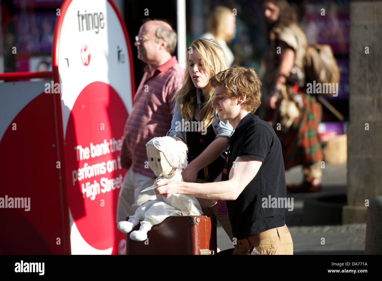 Edinburgh Festival Fringe performers handing out fliers for their show ...