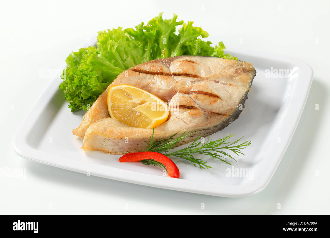 Grilled fish steak with lemon Stock Photo - Alamy