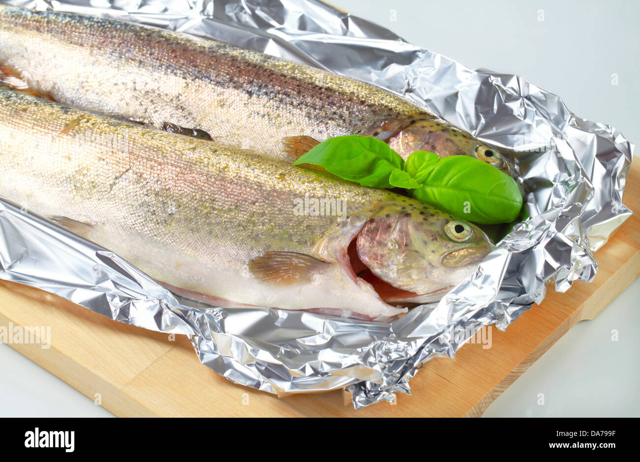 Trout fish on foil hi-res stock photography and images - Alamy