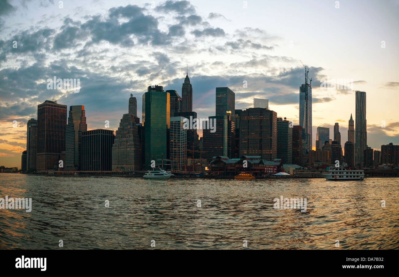 New York City panoramic cityscape in the evening at sunset Stock Photo ...