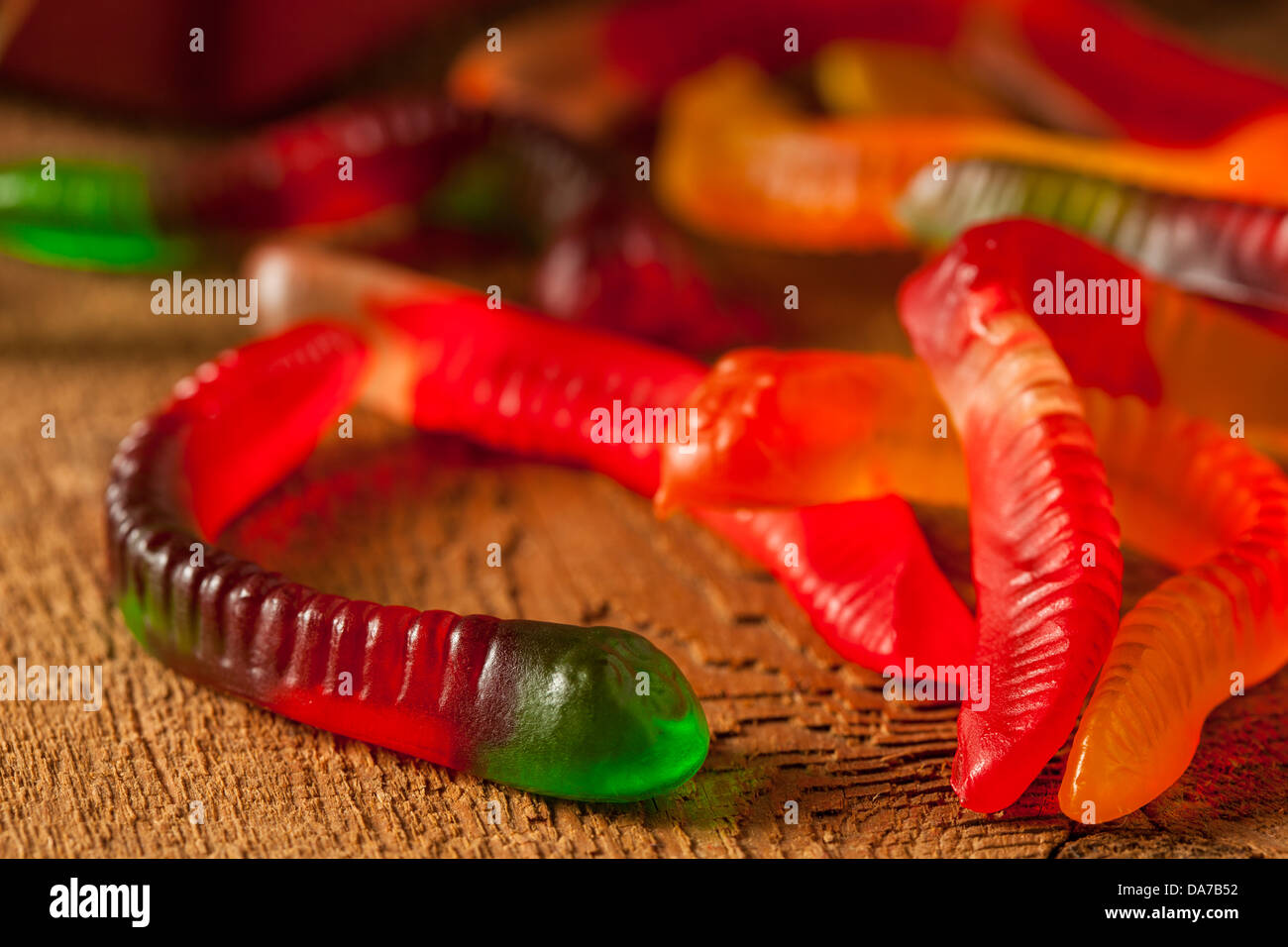 Colorful Fruity Gummy Worm Candy on a background Stock Photo - Alamy