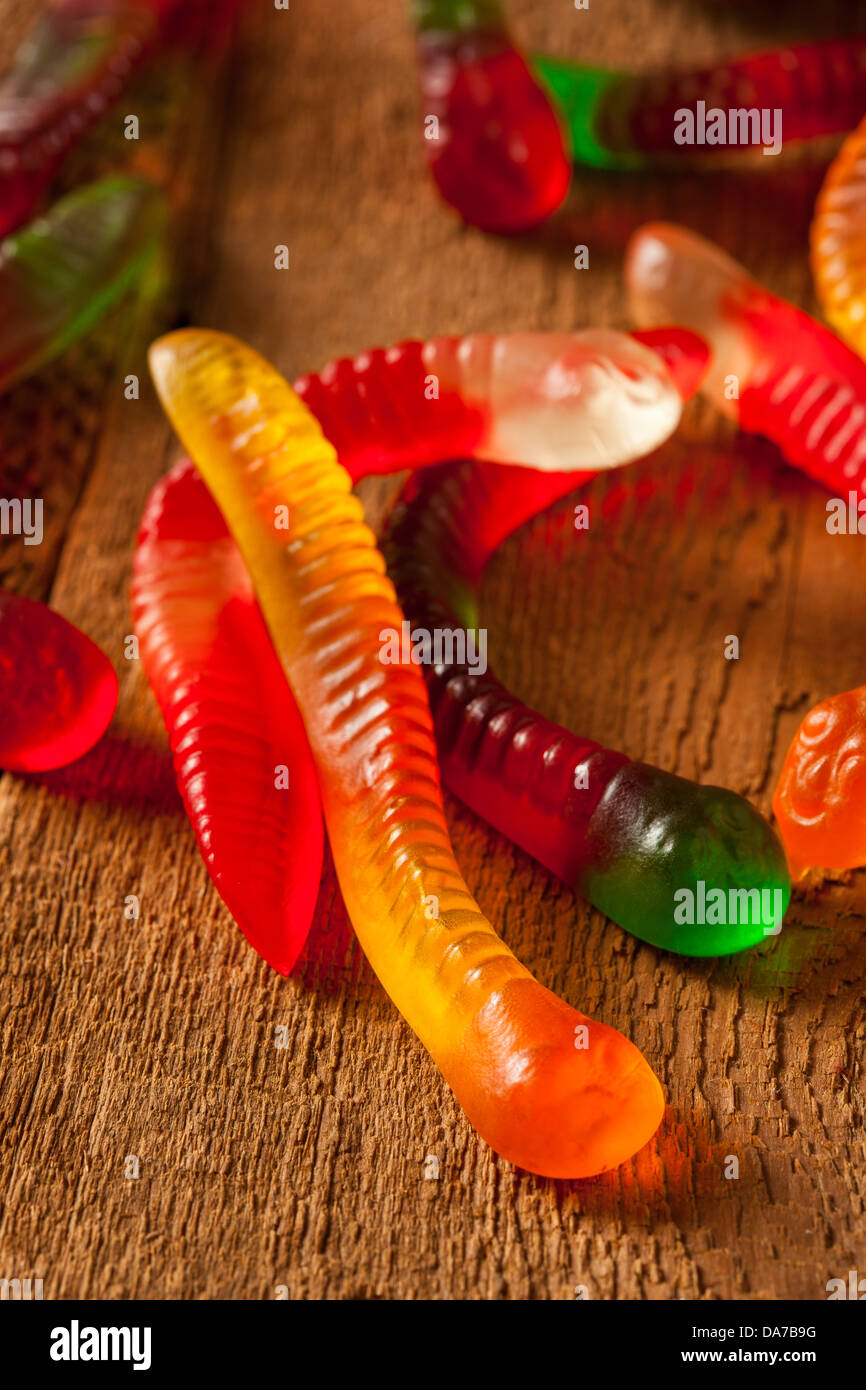 Colorful Fruity Gummy Worm Candy on a background Stock Photo - Alamy