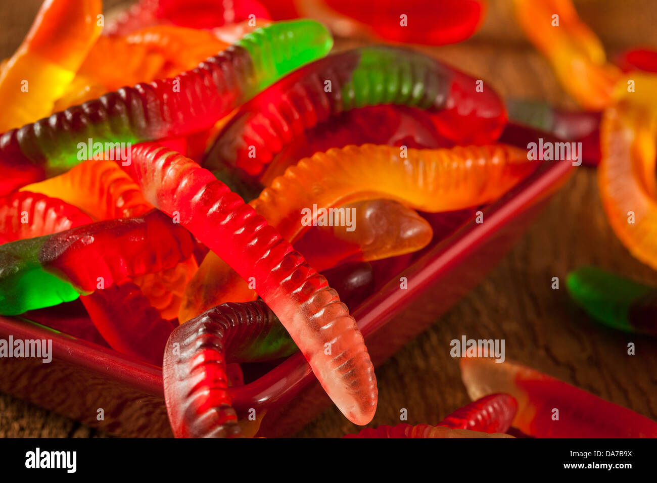Colorful Fruity Gummy Worm Candy on a background Stock Photo - Alamy