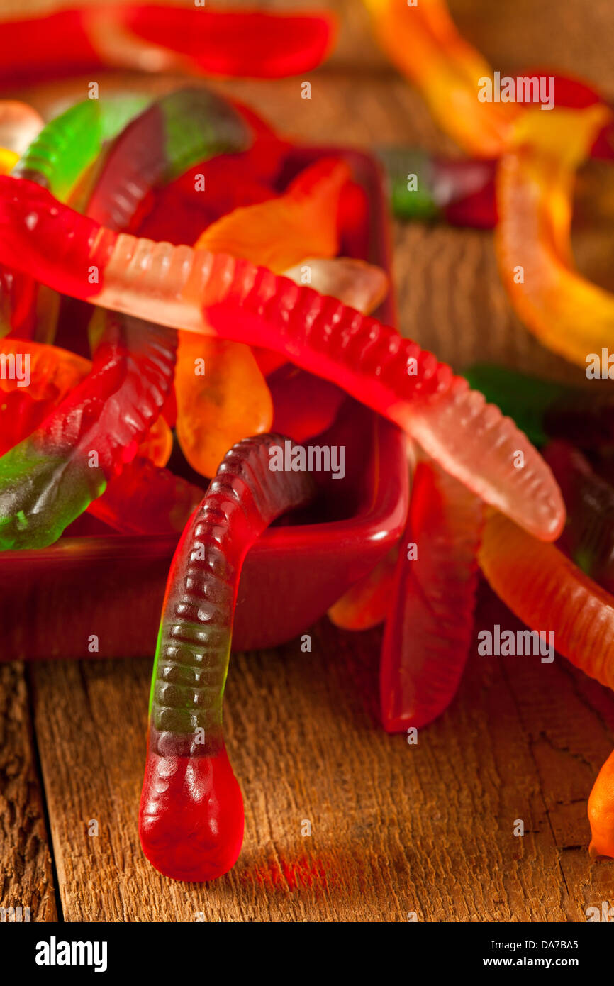 Colorful Fruity Gummy Worm Candy on a background Stock Photo - Alamy