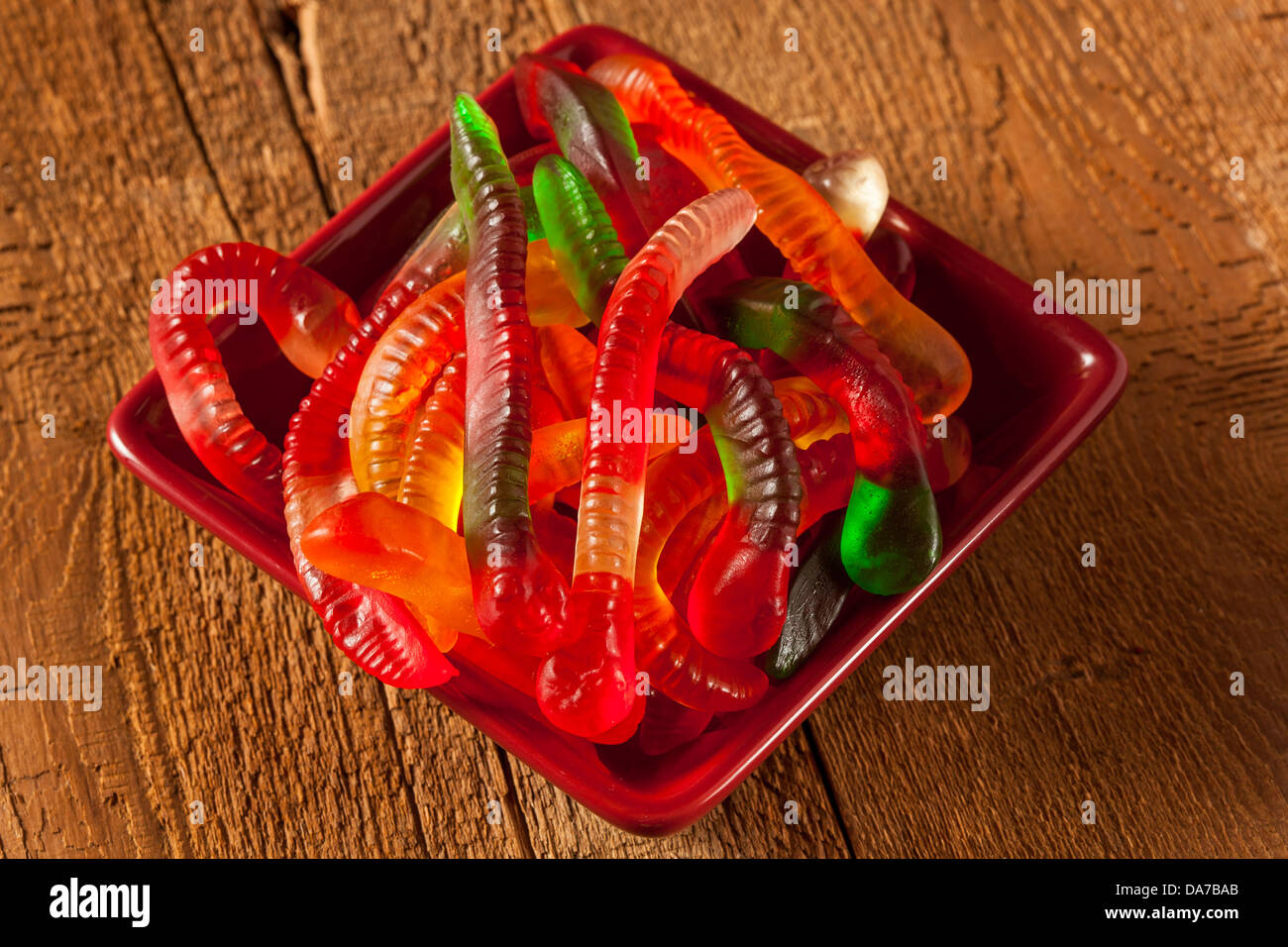 Colorful Fruity Gummy Worm Candy on a background Stock Photo - Alamy