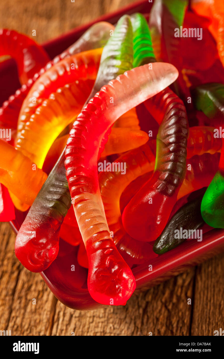 Colorful Fruity Gummy Worm Candy on a background Stock Photo - Alamy