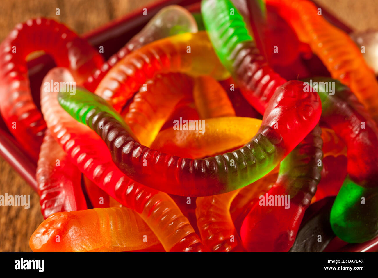 Colorful Fruity Gummy Worm Candy on a background Stock Photo - Alamy