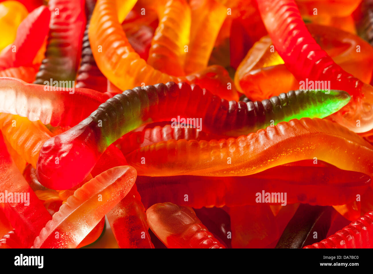 Colorful Fruity Gummy Worm Candy on a background Stock Photo - Alamy