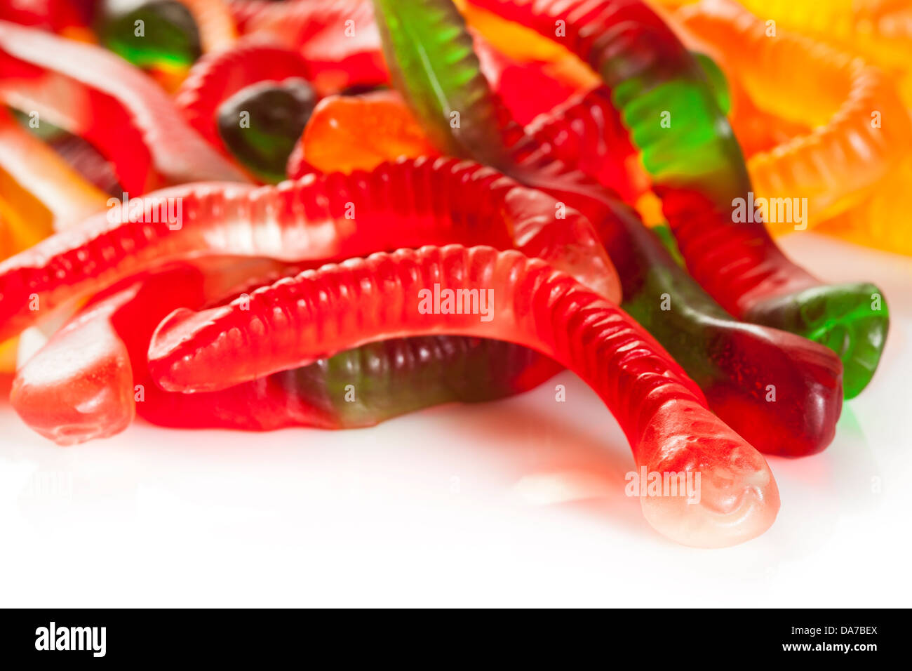 Colorful Fruity Gummy Worm Candy on a background Stock Photo - Alamy