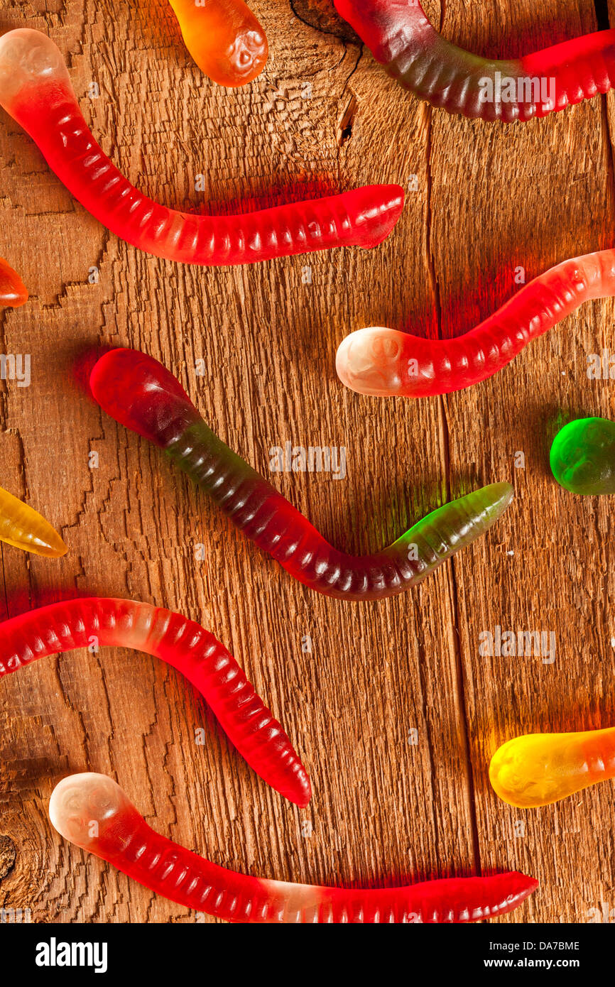 Colorful Fruity Gummy Worm Candy on a background Stock Photo - Alamy