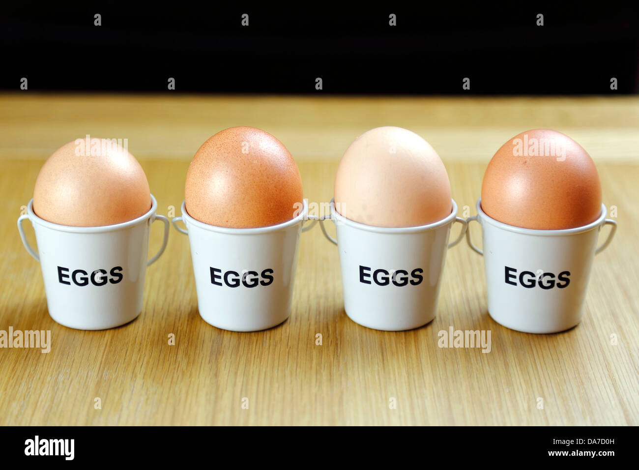 Four hens eggs in a line Stock Photo - Alamy