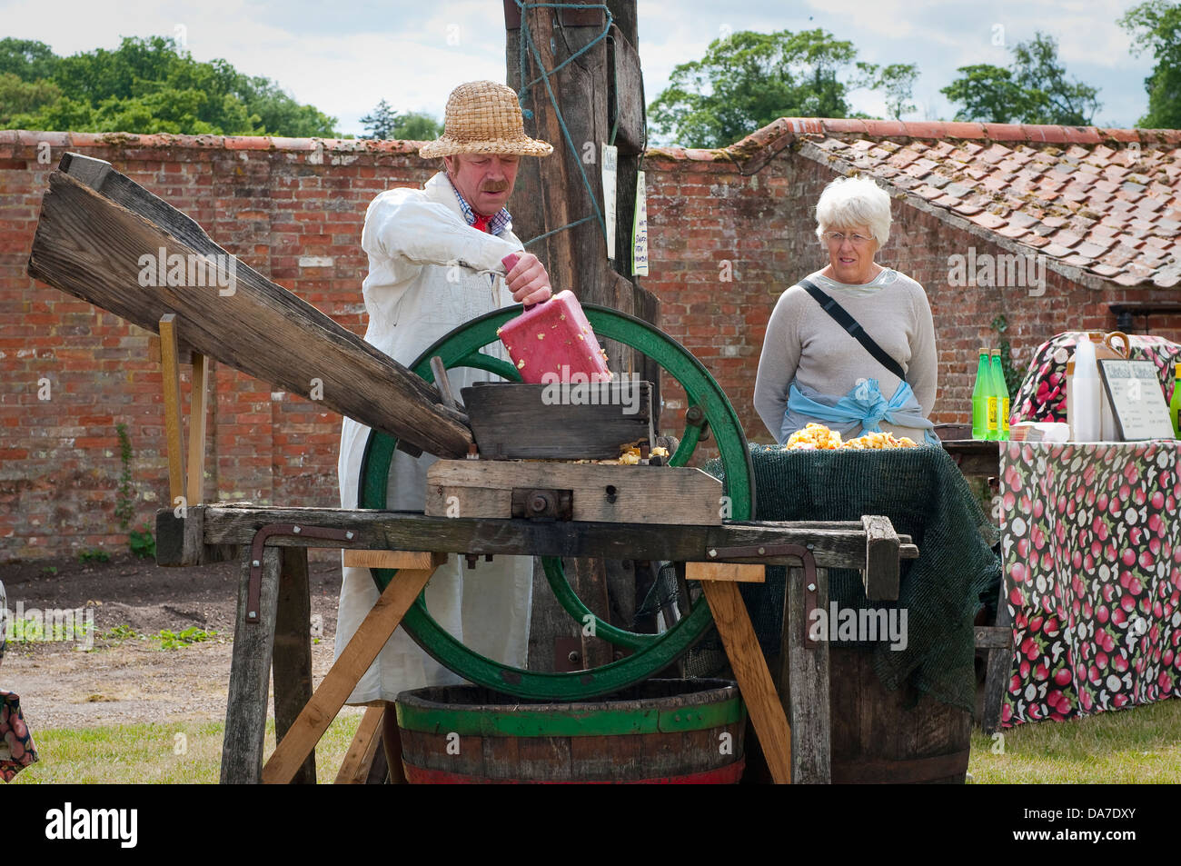 Man making cider the old fashioned way, Blickling Hall fair, Norfolk ...