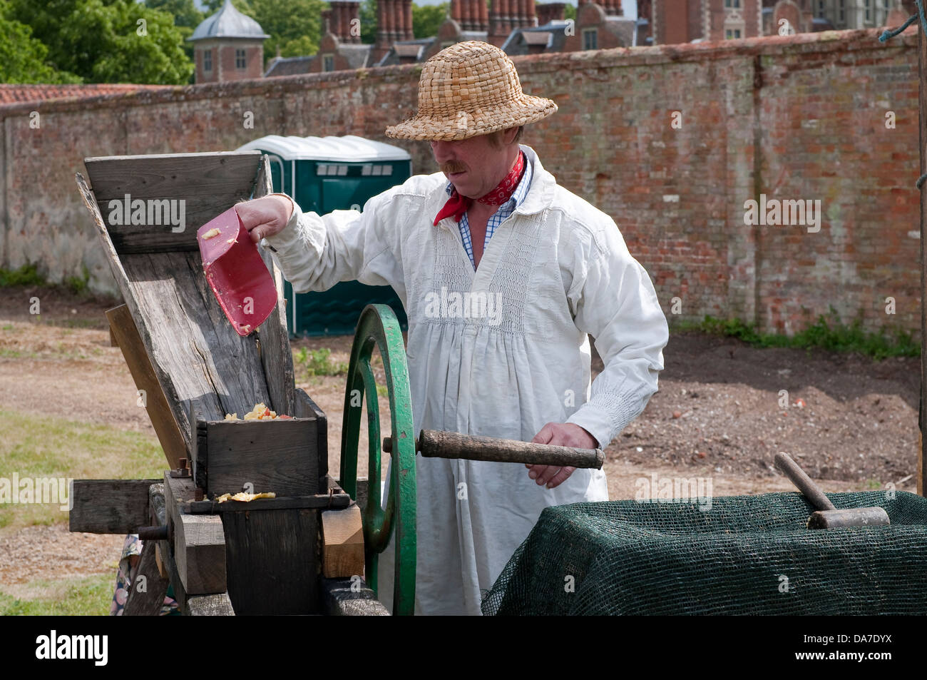 Man making cider the old fashioned way, Blickling Hall fair, Norfolk ...