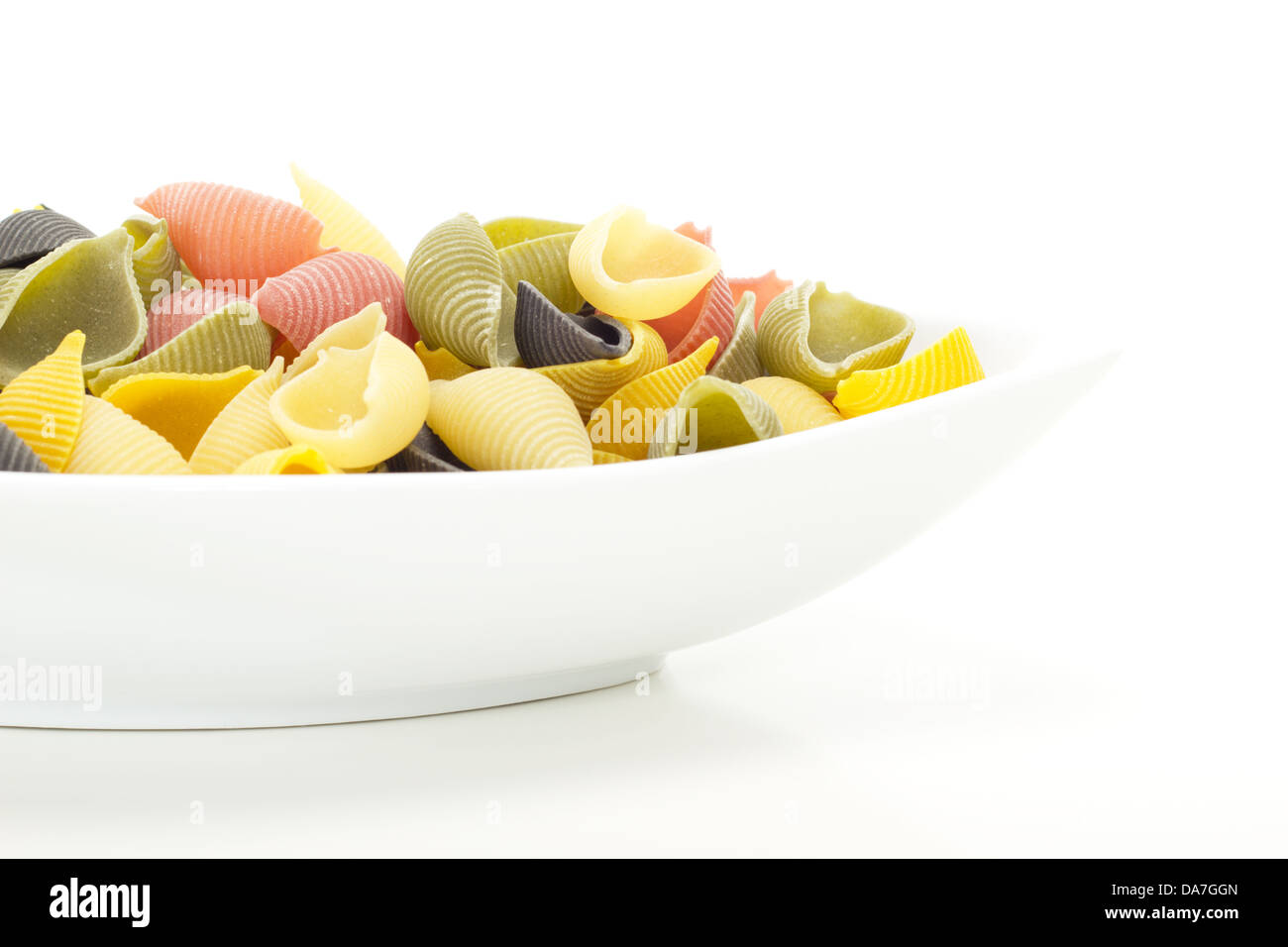 Cooking italian shell noodles for delicate meal Stock Photo - Alamy