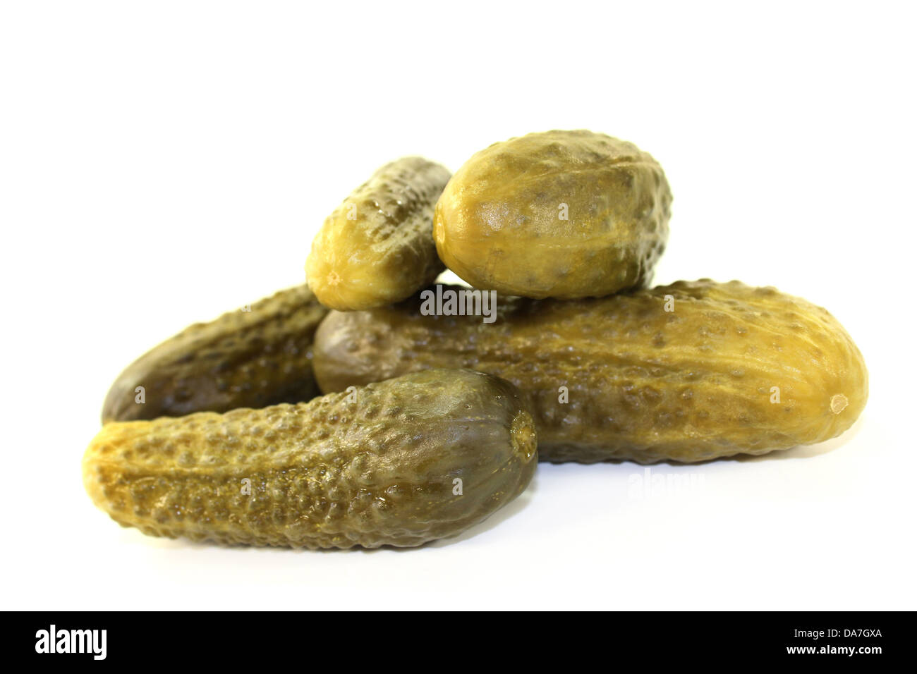 fresh green pickles in front of white background Stock Photo - Alamy