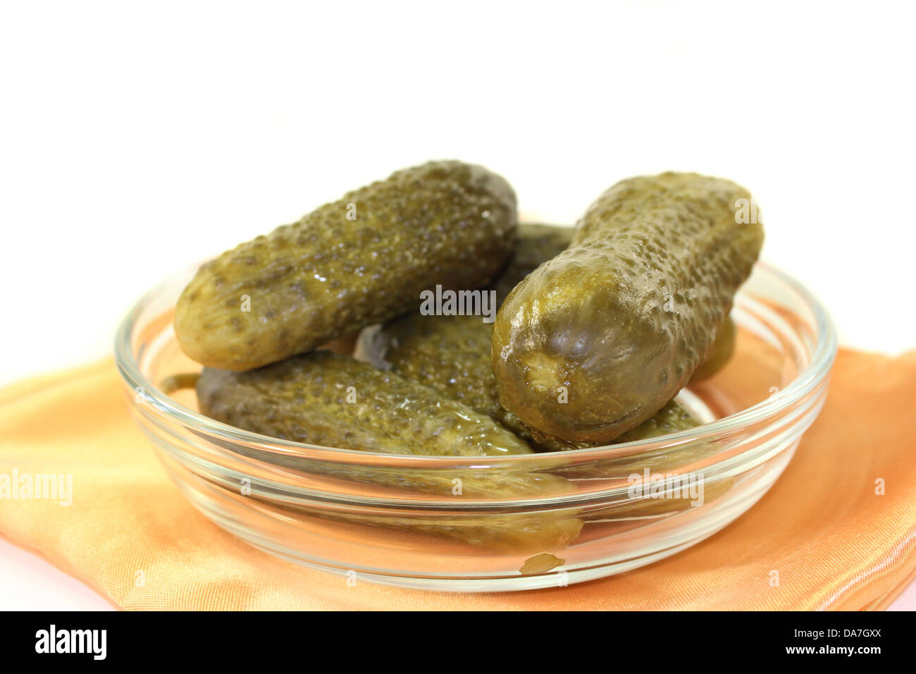 fresh green pickles in front of white background Stock Photo - Alamy