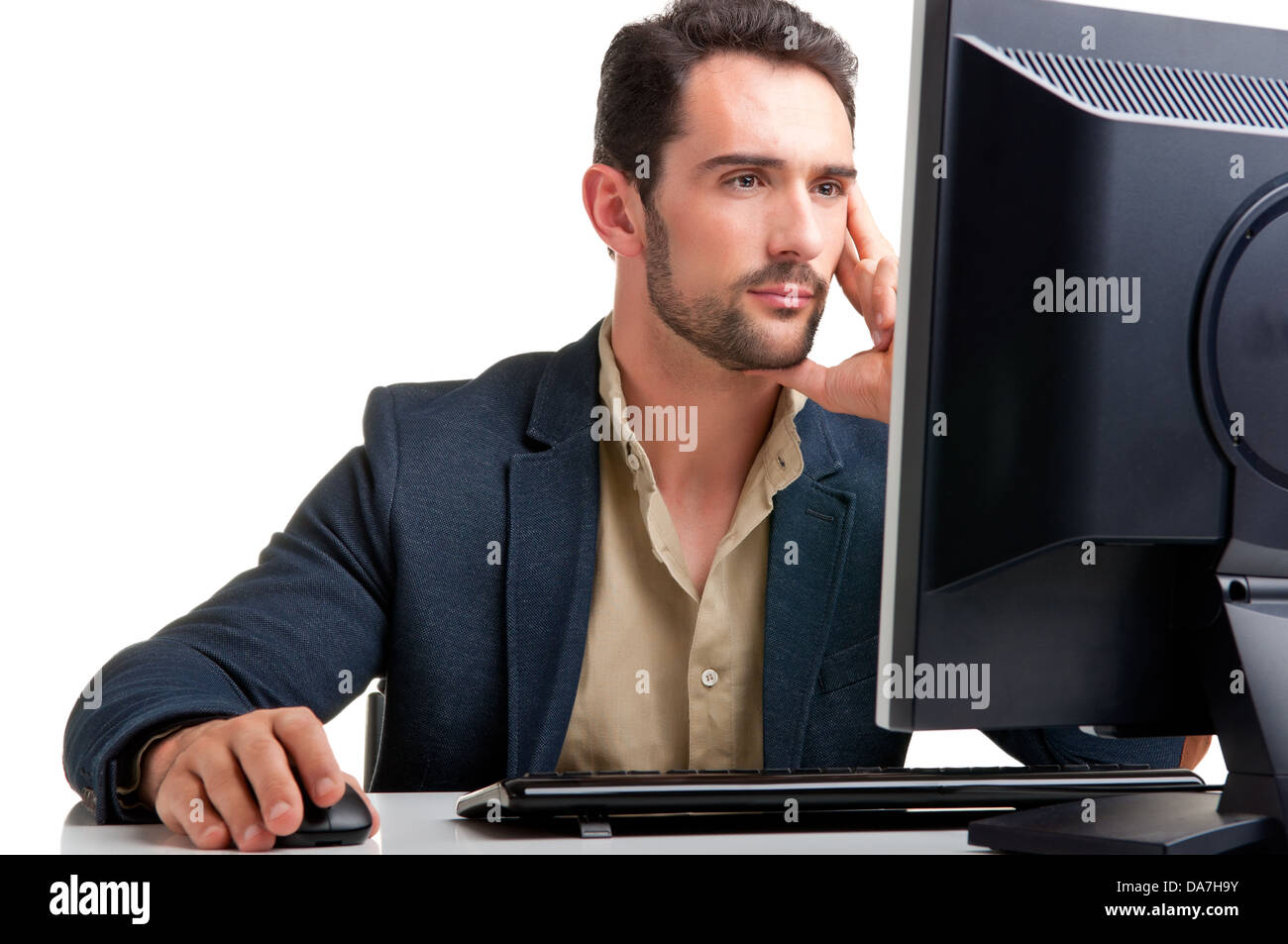 Man looking at a computer screen, thinking about the job at hand Stock ...